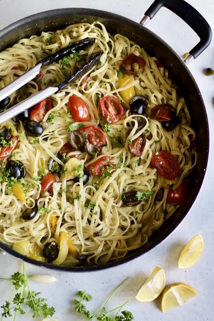 Pot with tongs and garnishes - Vegan One Pot Pasta Puttanesca 7 - Very ...